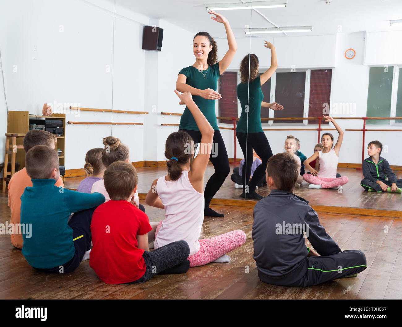 interested children primary school age rehearsing ballet dance in ...