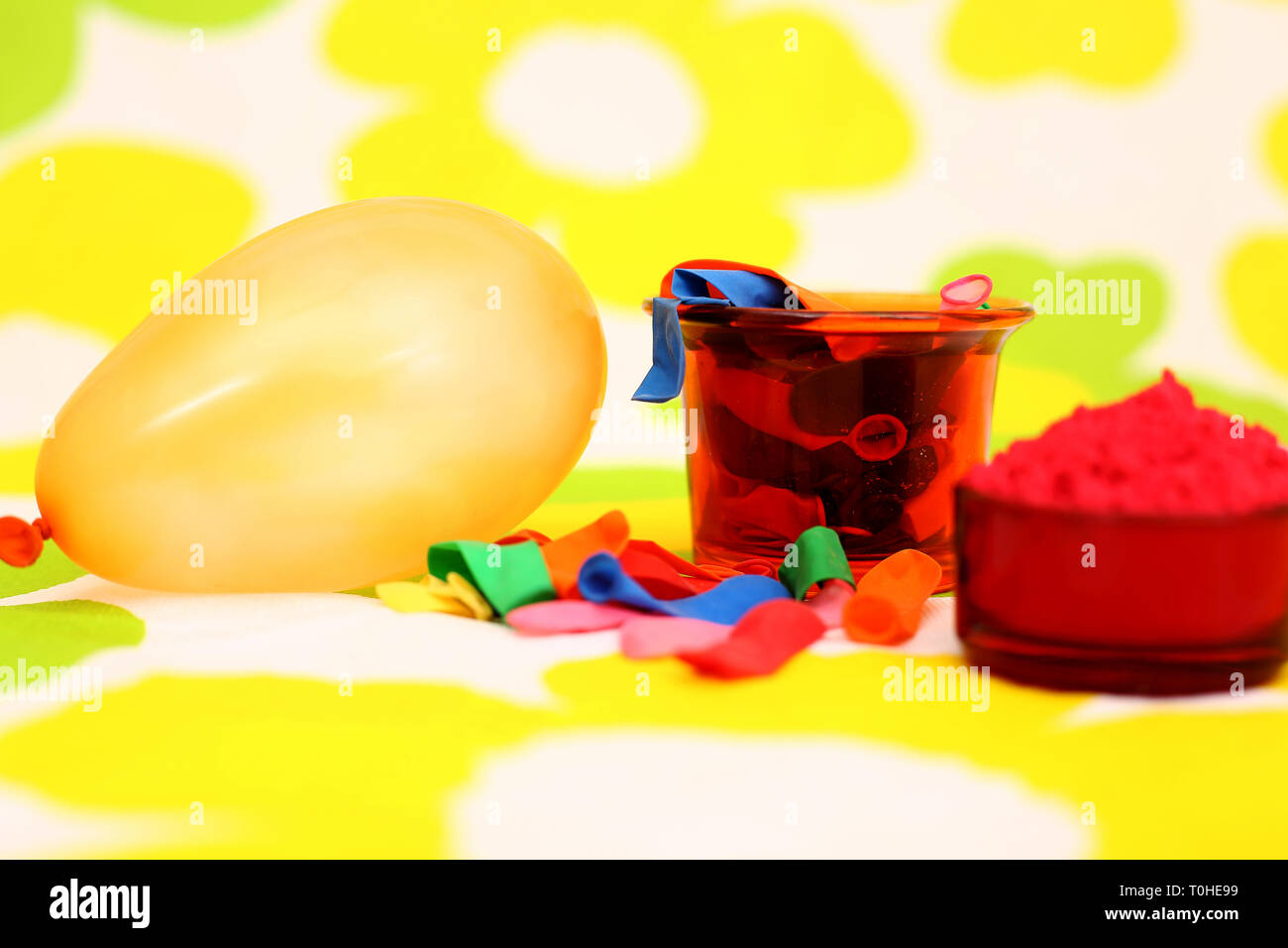 Picture of red holi color with balloons for holi festival. Isolated on ...