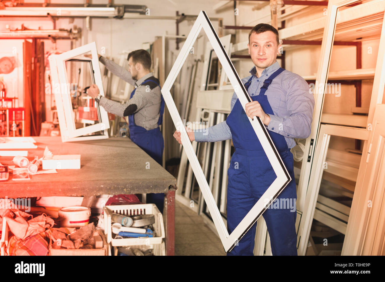 Two diligent friendly smiling hi-res stock photography and images - Alamy