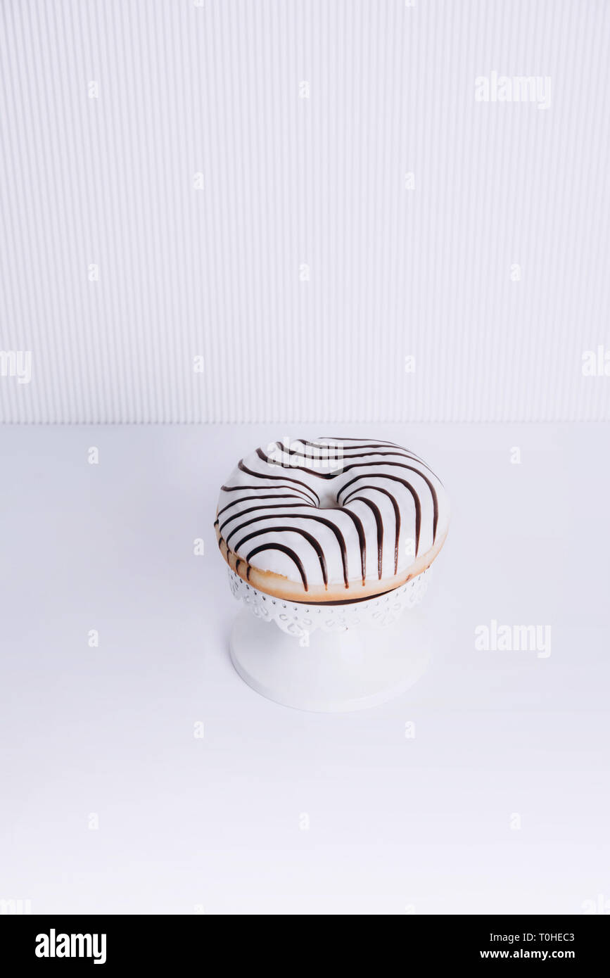 Striped donut on a white background Stock Photo - Alamy