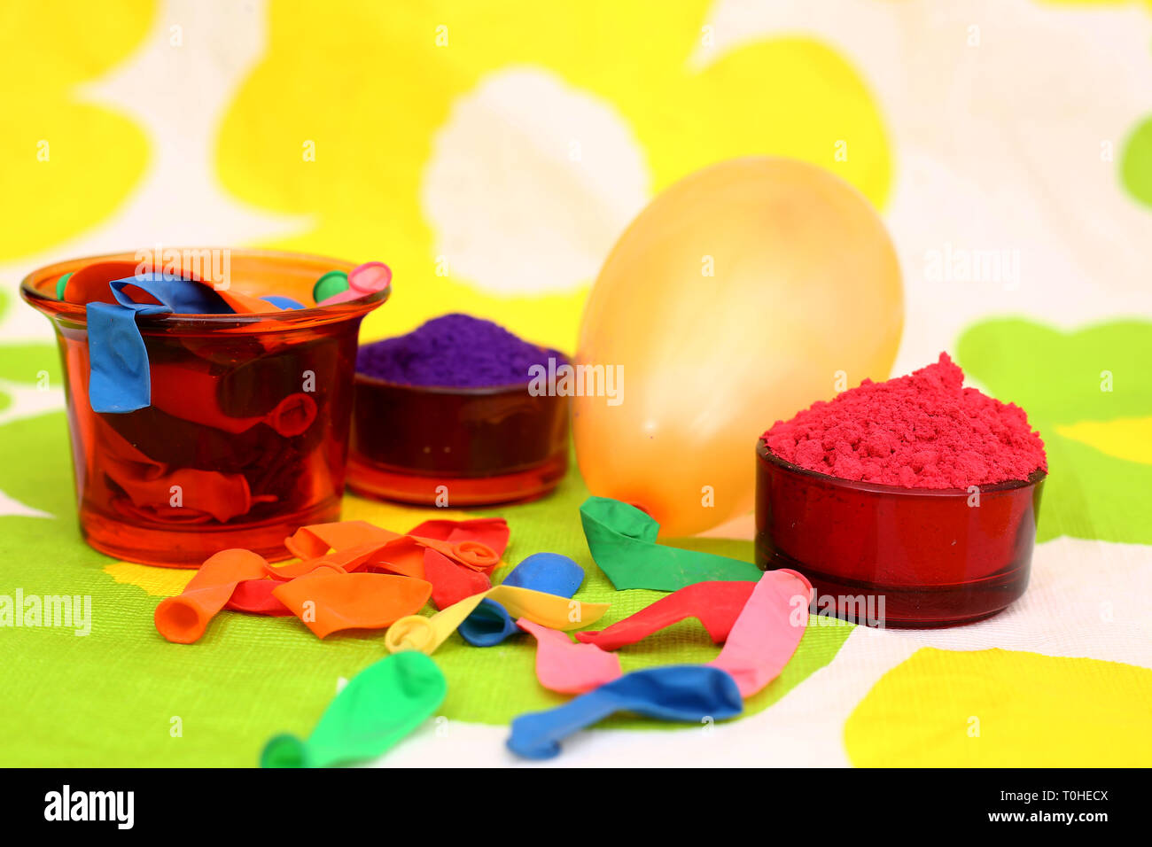 Portrait of red holi color with balloons for holi festival. Isolated on ...