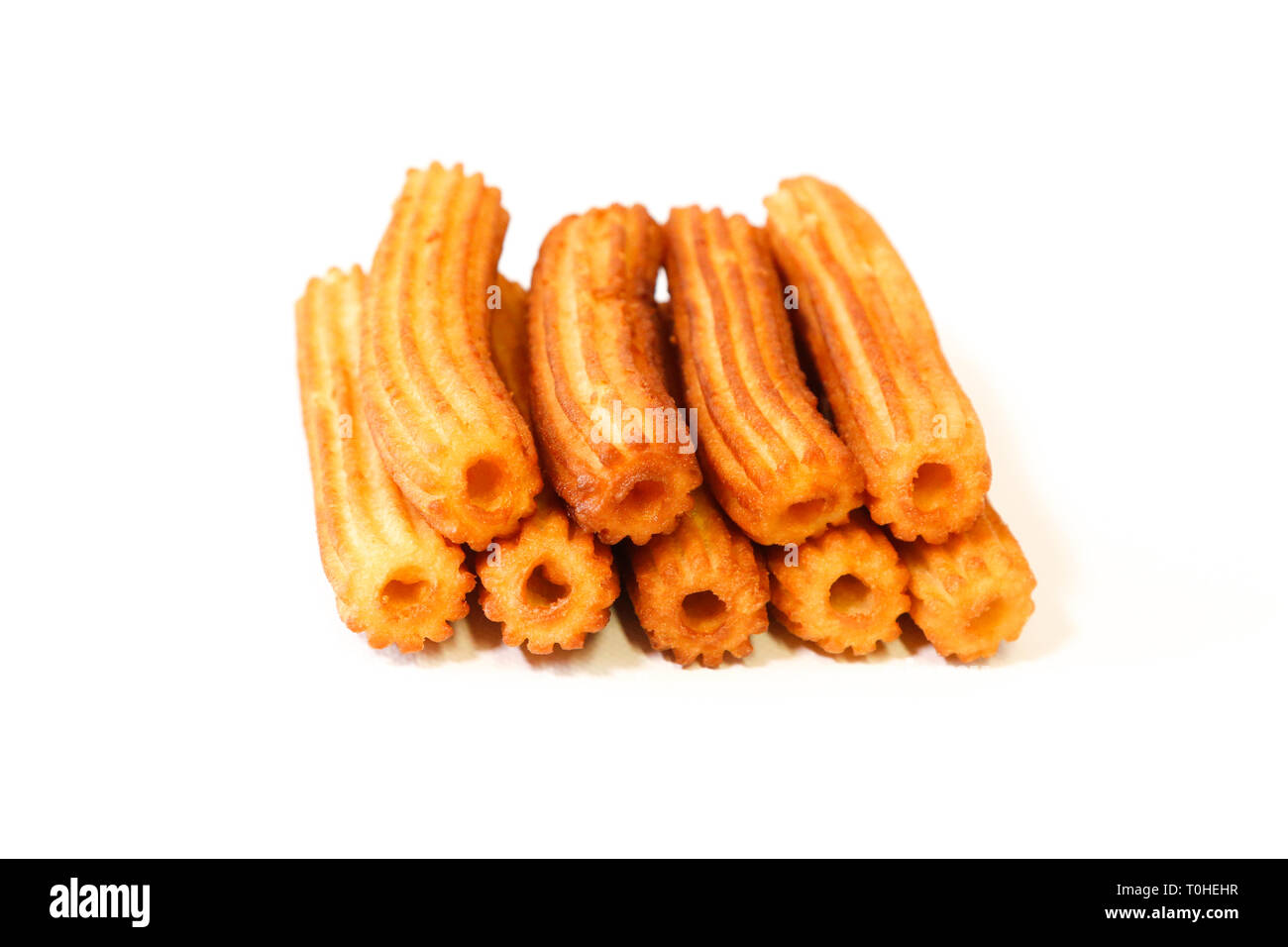 spanish fritters on white background Stock Photo - Alamy