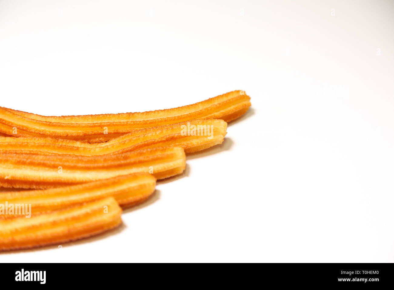 spanish fritters with white background Stock Photo - Alamy