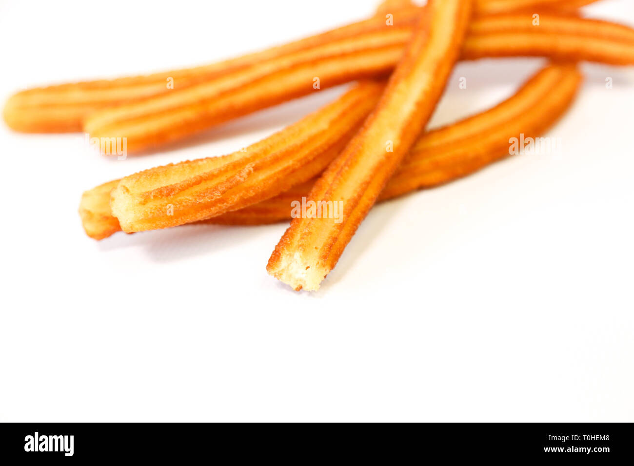 spanish fritters with white background Stock Photo - Alamy