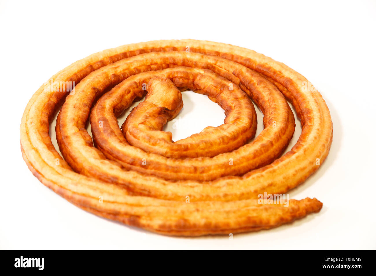 Big spanish fritter dough placed spirally Stock Photo - Alamy