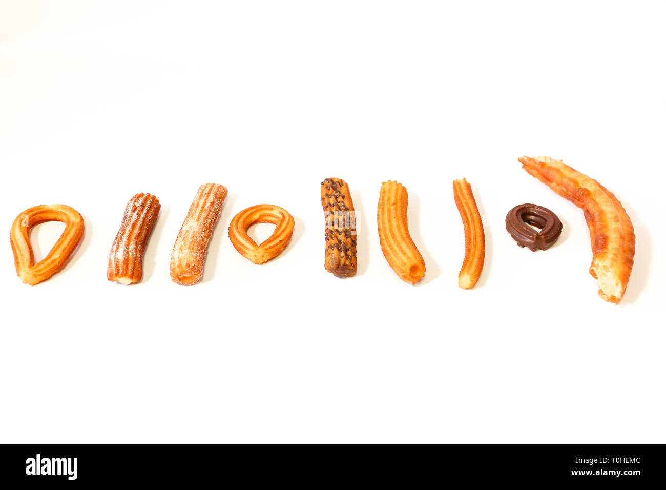 different types of spanish fritters on white background Stock Photo - Alamy