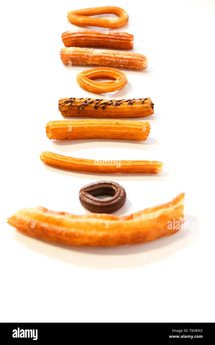 different types of spanish fritters on white background Stock Photo - Alamy