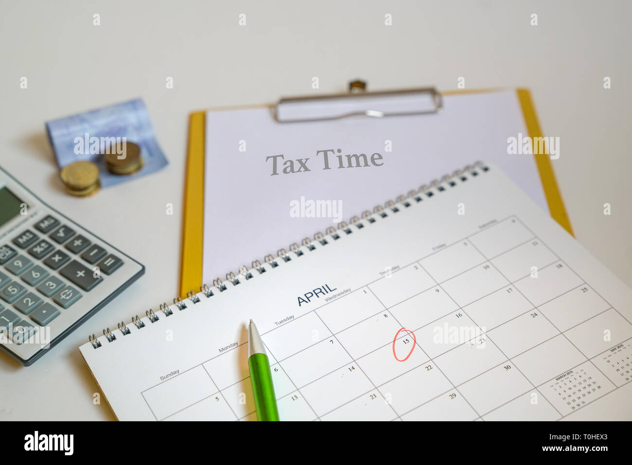 Tax filing reminder : April 15th circled on calendar Stock Photo - Alamy