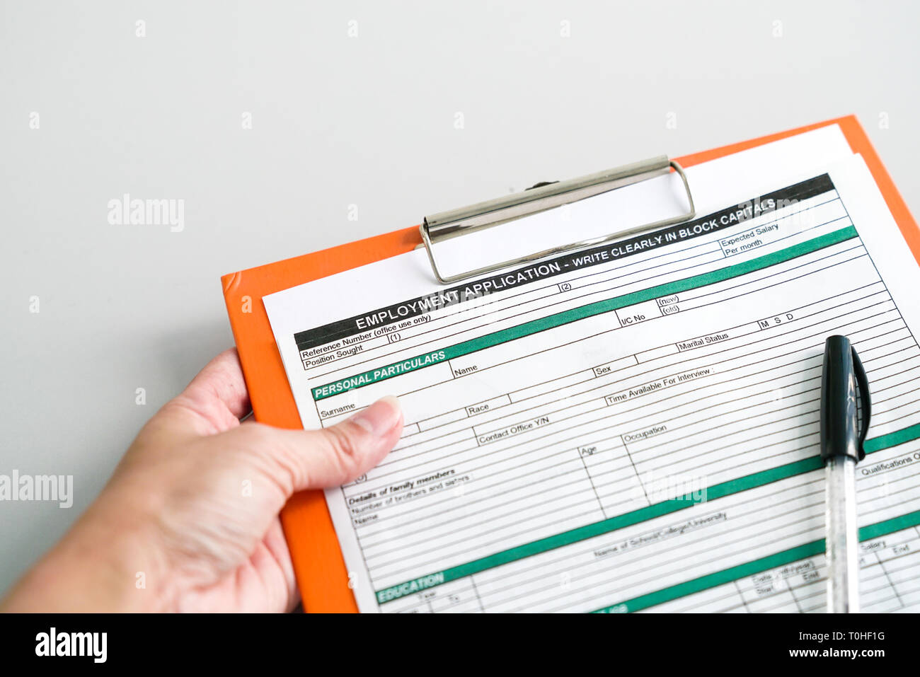 Seeking job concept, filling up the information in an employment ...