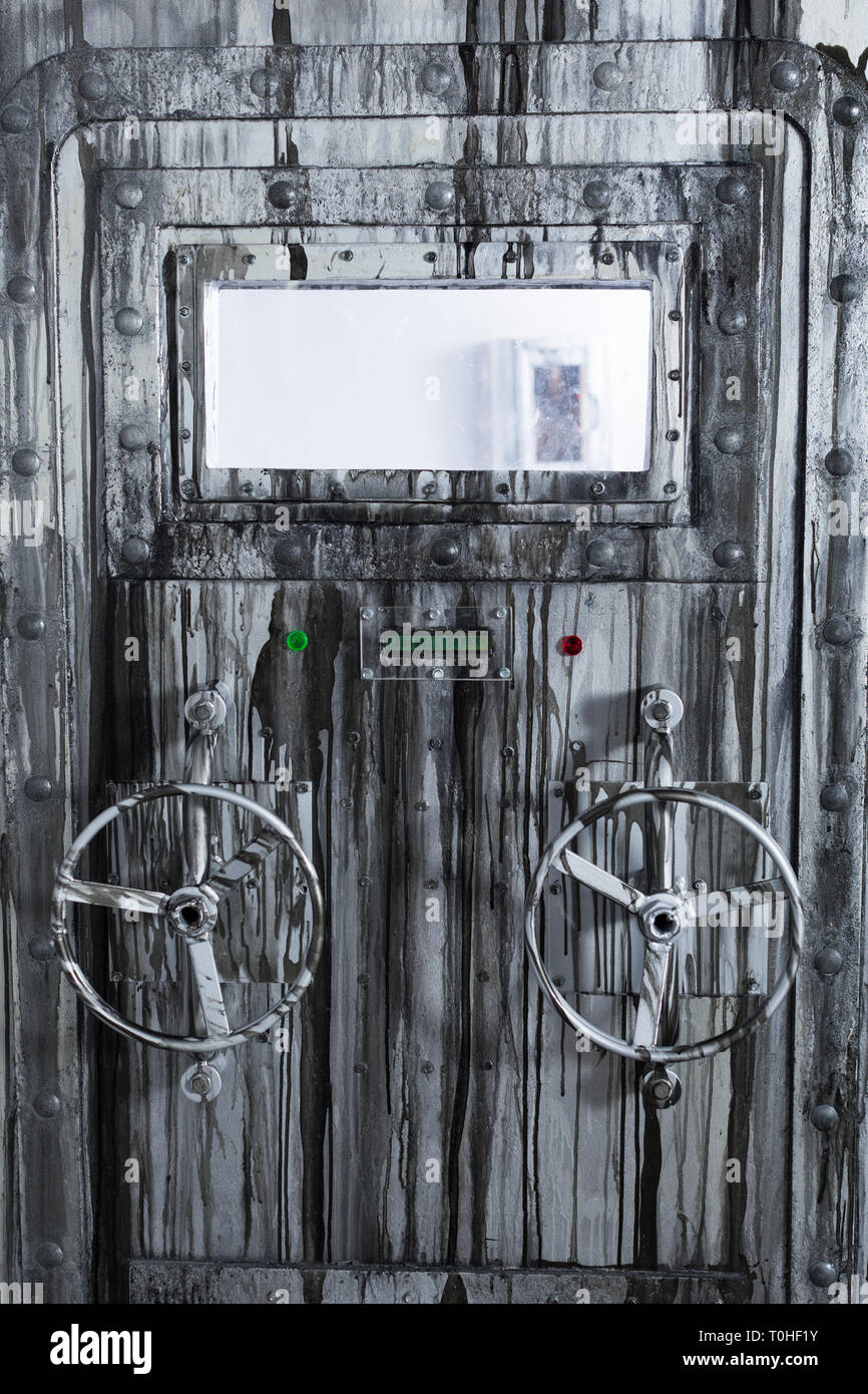 Image of locked grey door of lab in lost room Stock Photo - Alamy