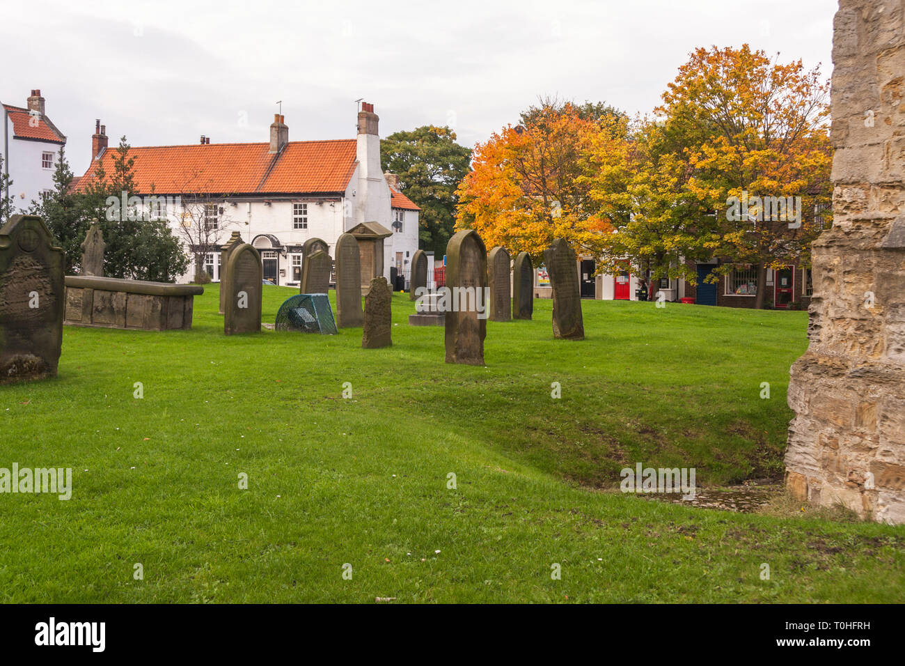 Saint Edmund's churchyard,Sedgefield,Co.Durham,England showing trees in ...