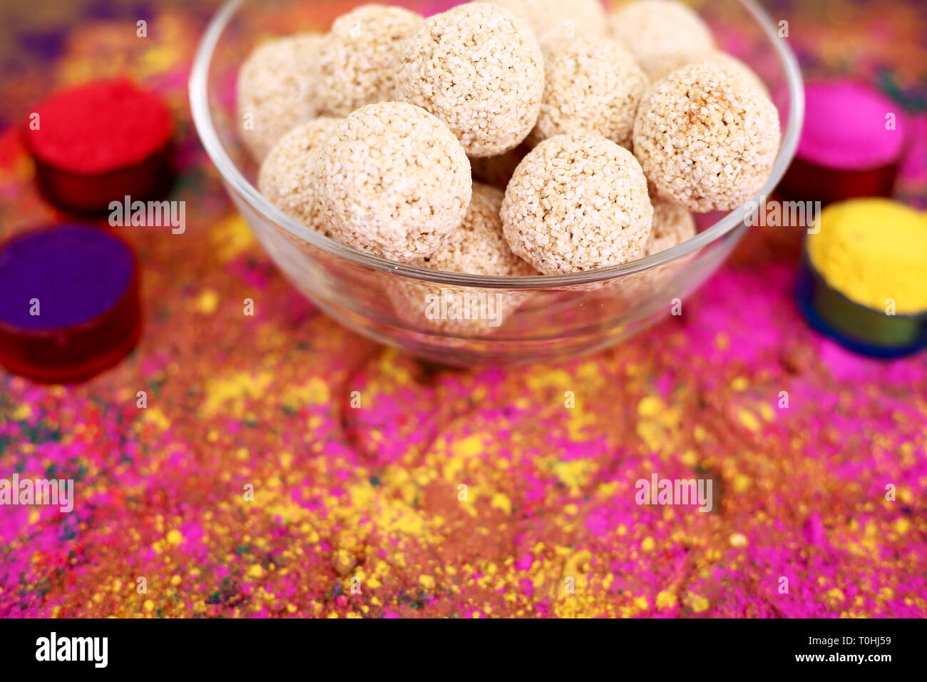 Picture of organic holi color with cholai ke ladoo in the glass bowl ...