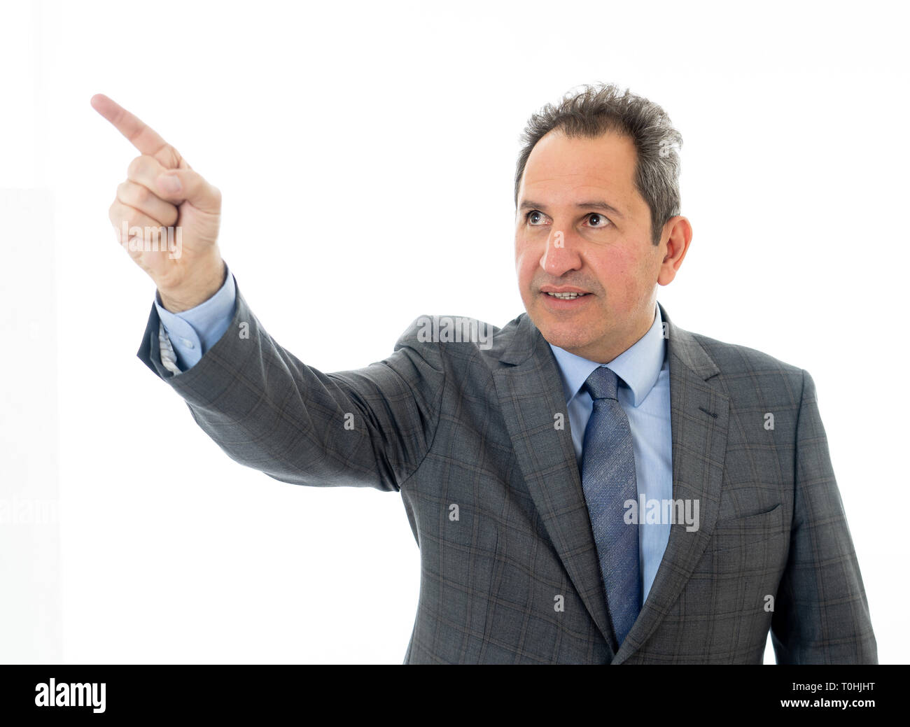 Studio portrait of Mature business man pointing as using a virtual ...