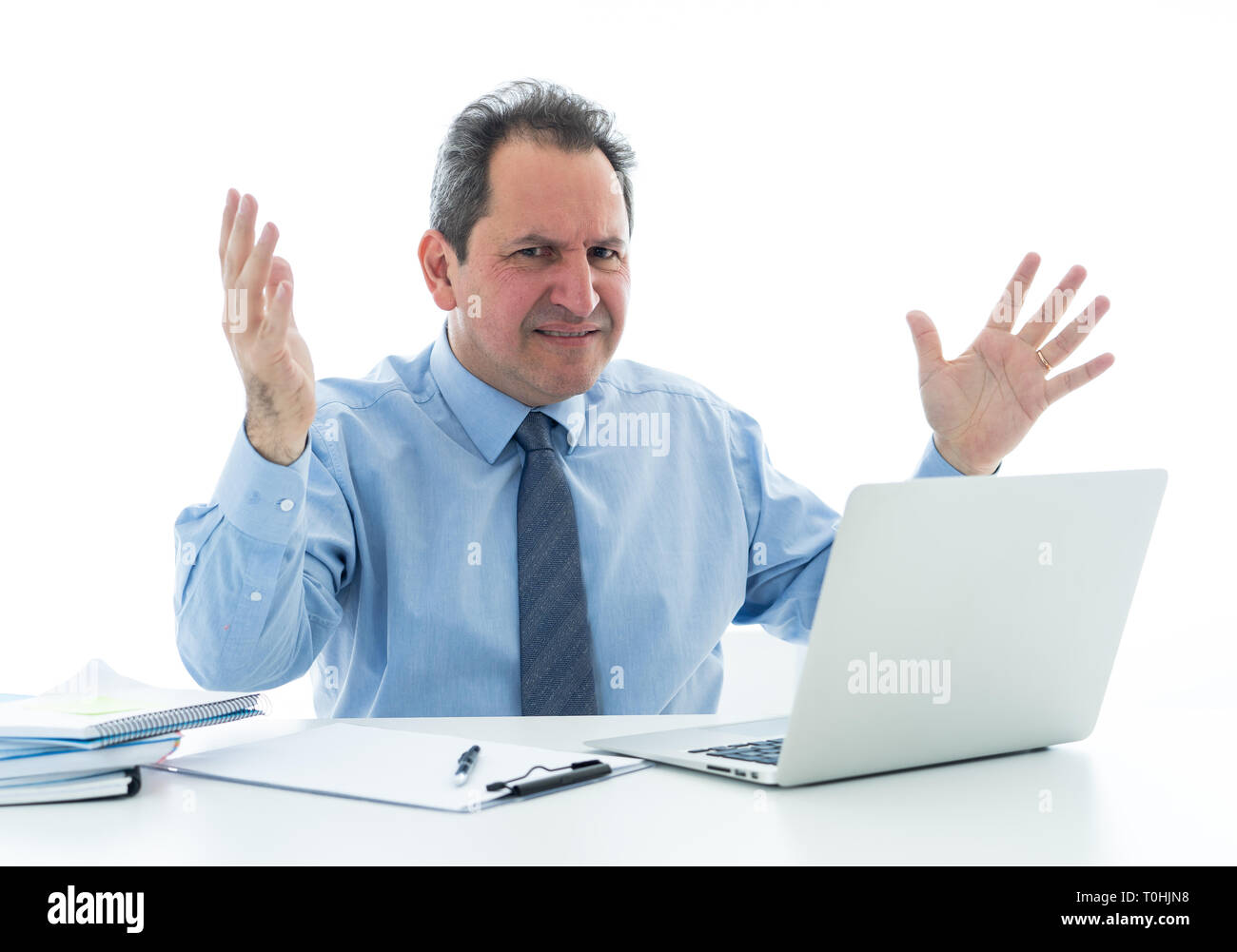 Angry and frustrated middle aged businessman overworked at desk upset ...