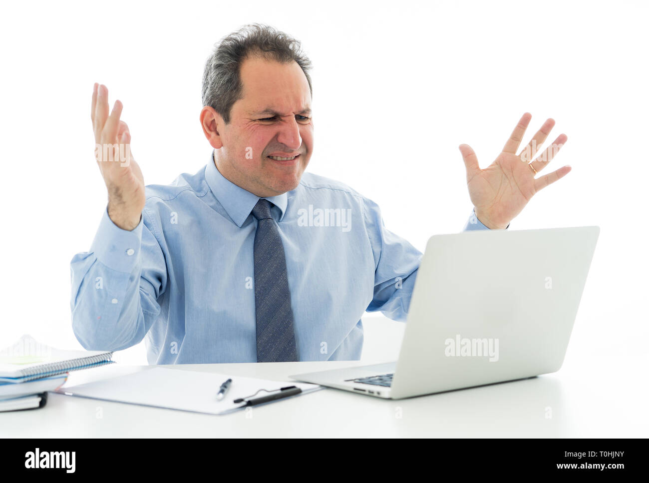 Angry and frustrated middle aged businessman overworked at desk upset ...