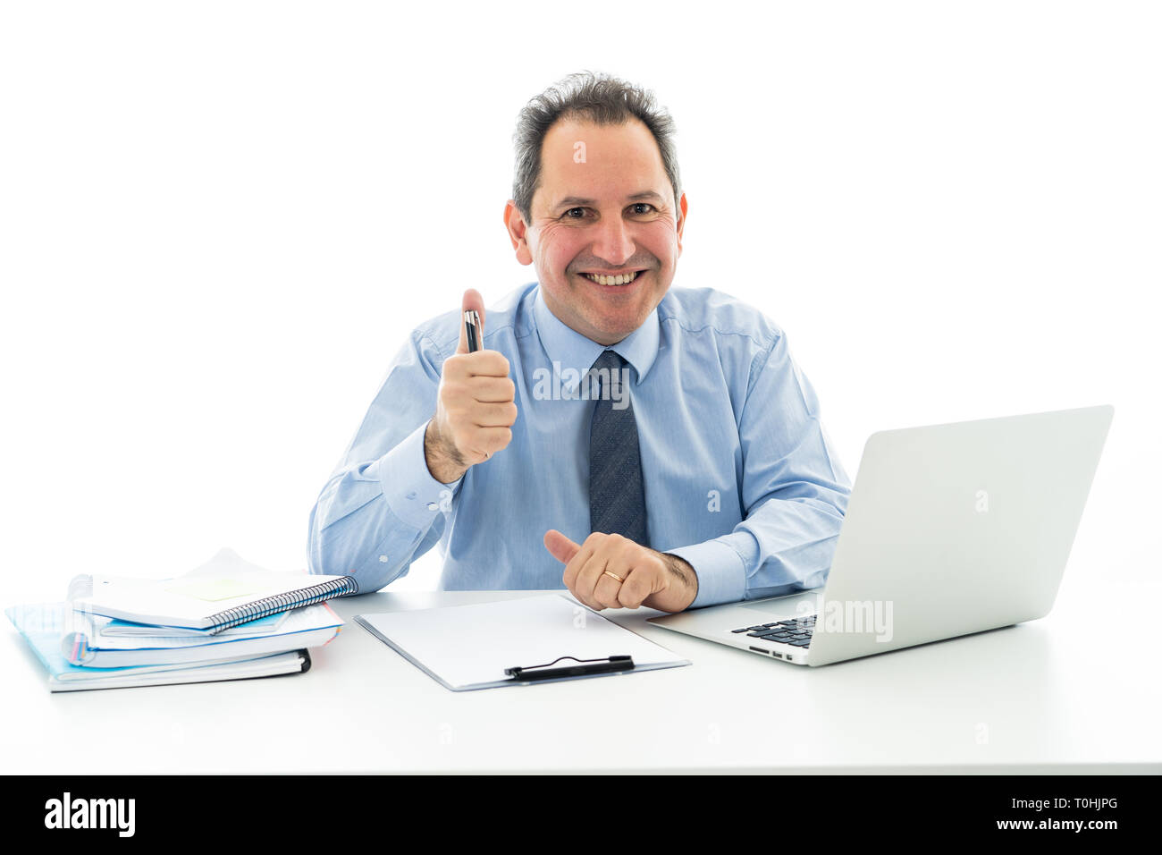 Smiling and confident middle aged executive businessman with laptop ...