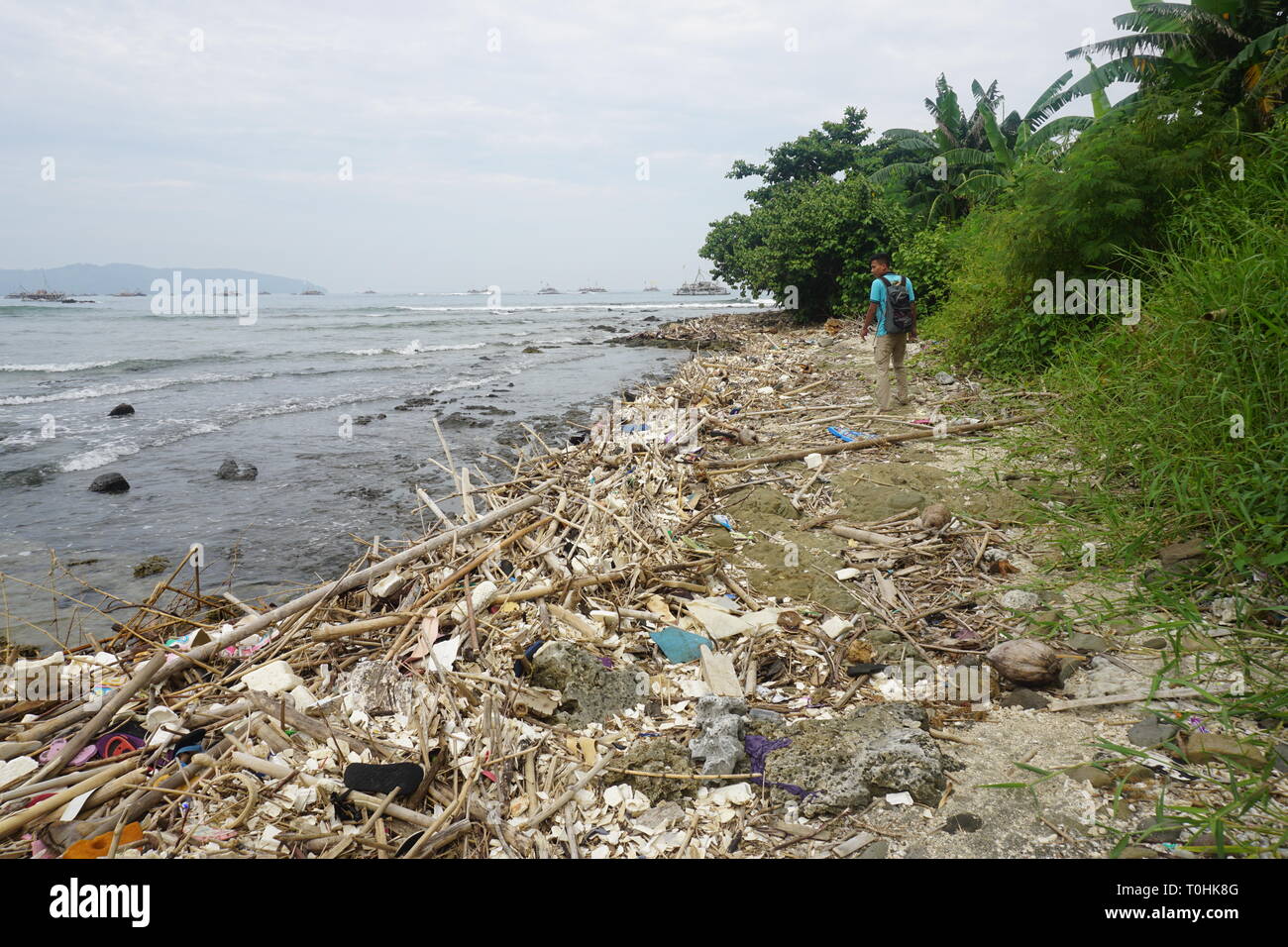 Polluted island beach Stock Photo - Alamy