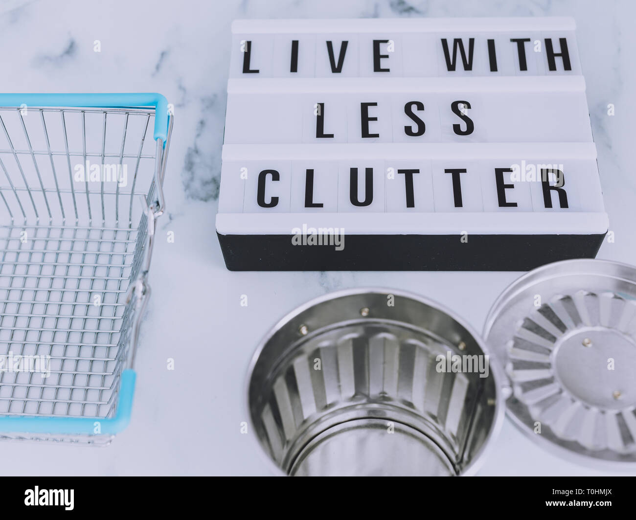 ecology and consumerism concept: live with less clutter message on ...