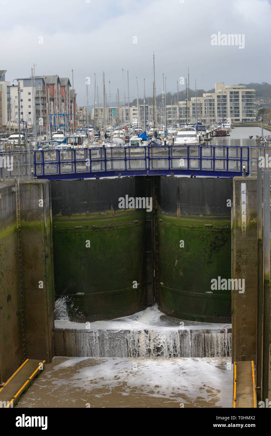 The giant gates of a marina lock holding back millions of gallons of ...