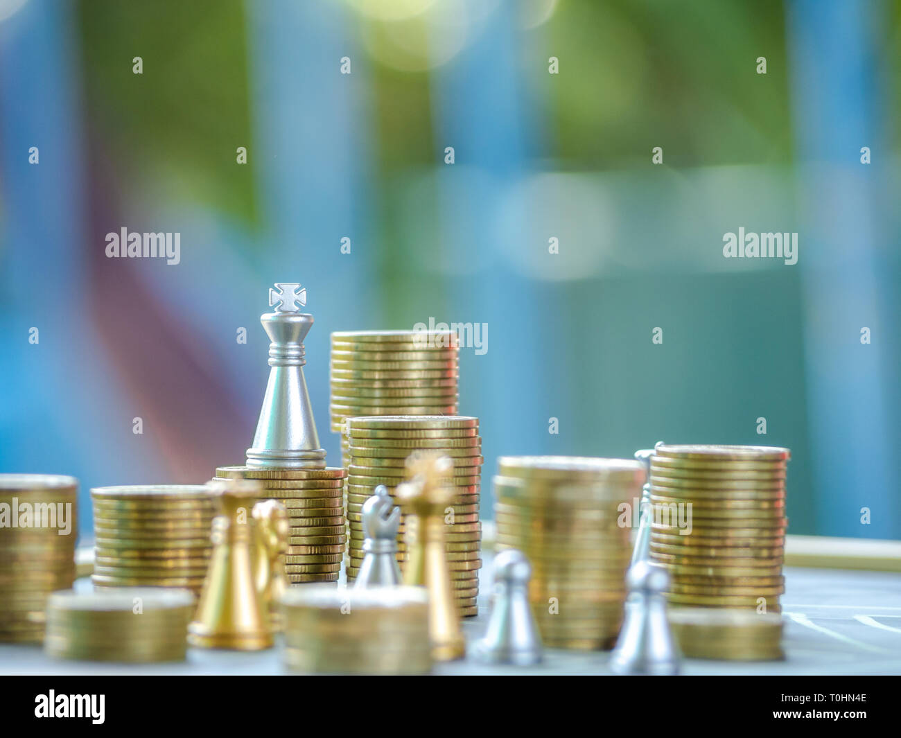 The chess gold king on coins stack with copy space Stock Photo - Alamy