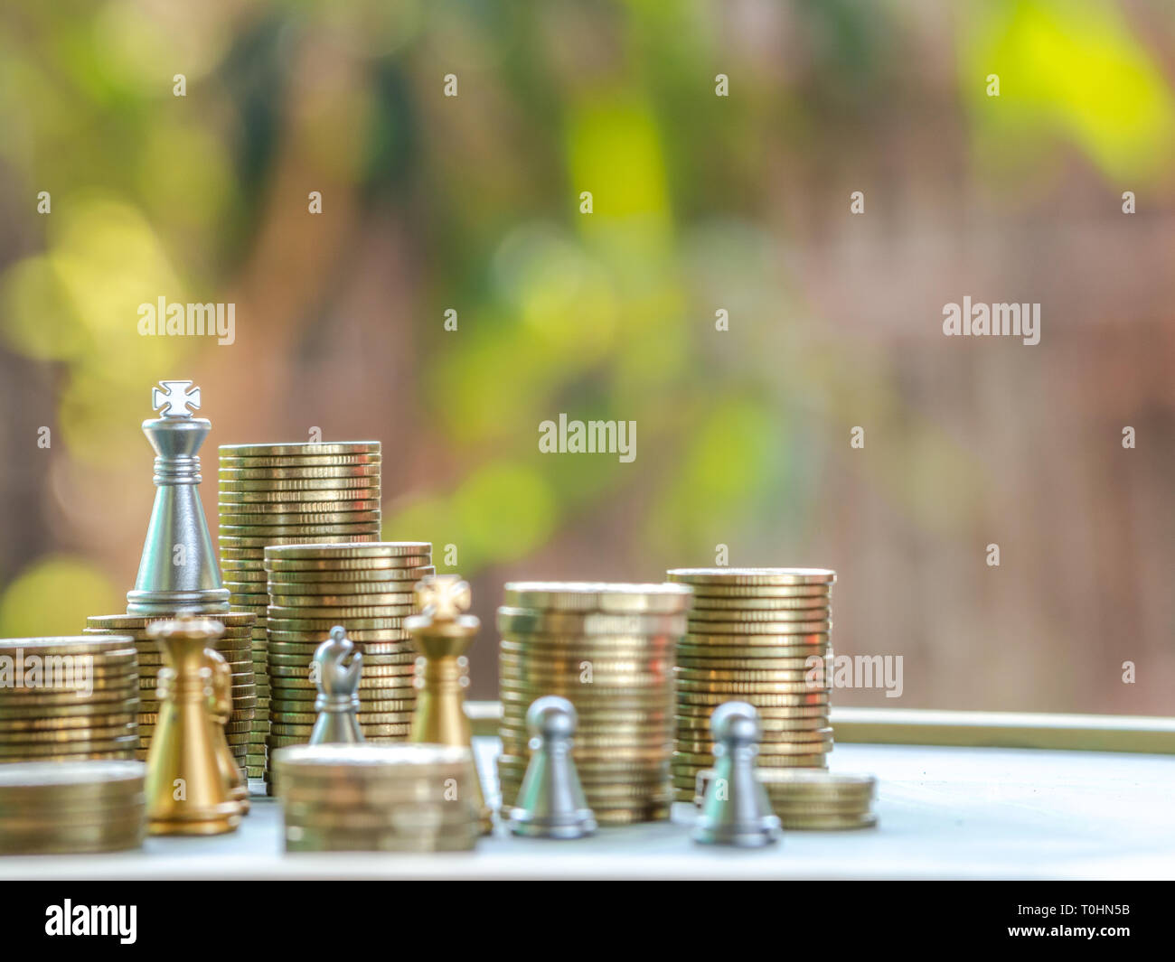 The chess gold king on coins stack with copy space Stock Photo - Alamy