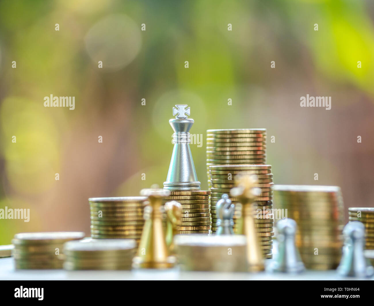 The chess gold king on coins stack with copy space Stock Photo - Alamy