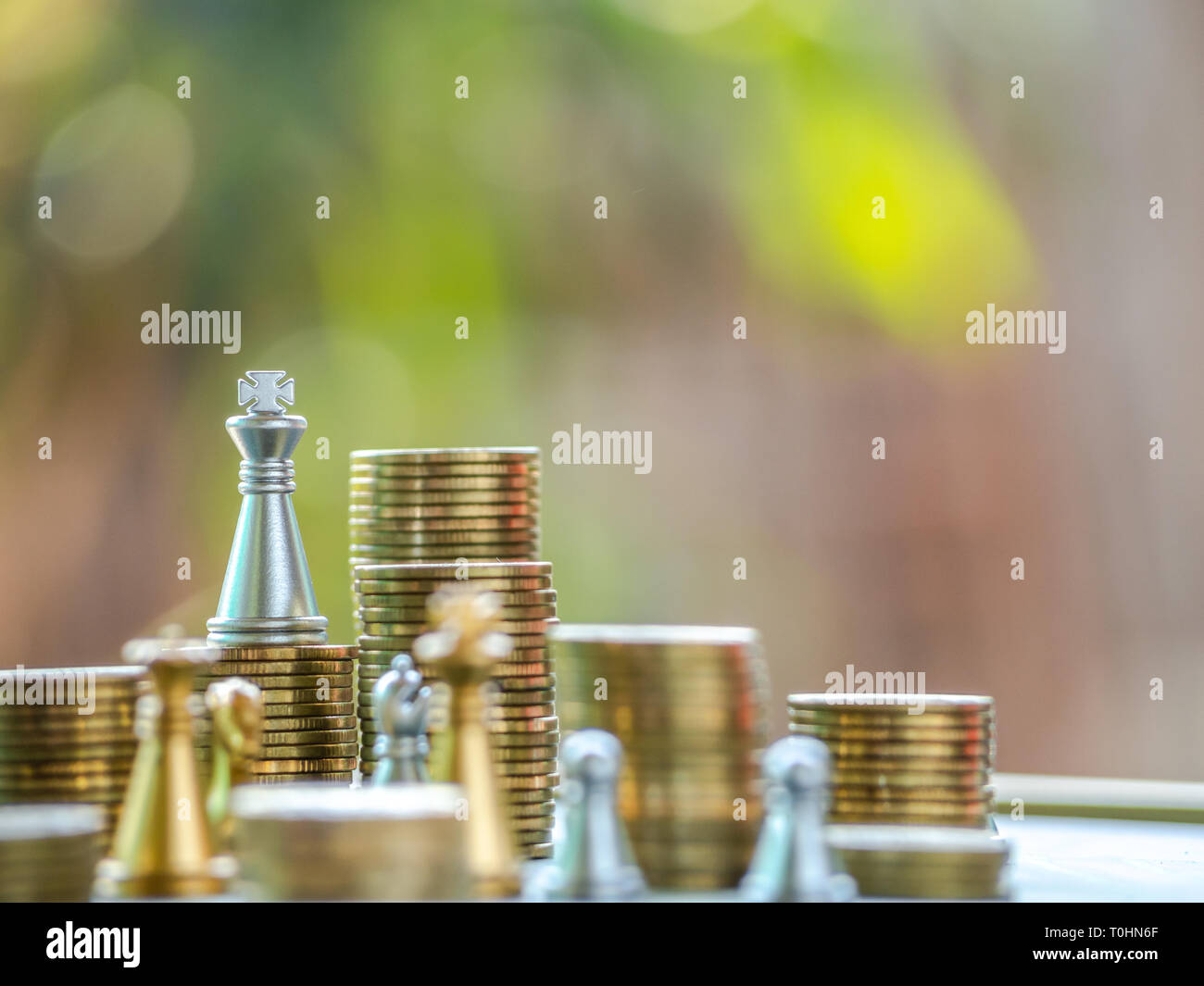 The chess gold king on coins stack with copy space Stock Photo - Alamy