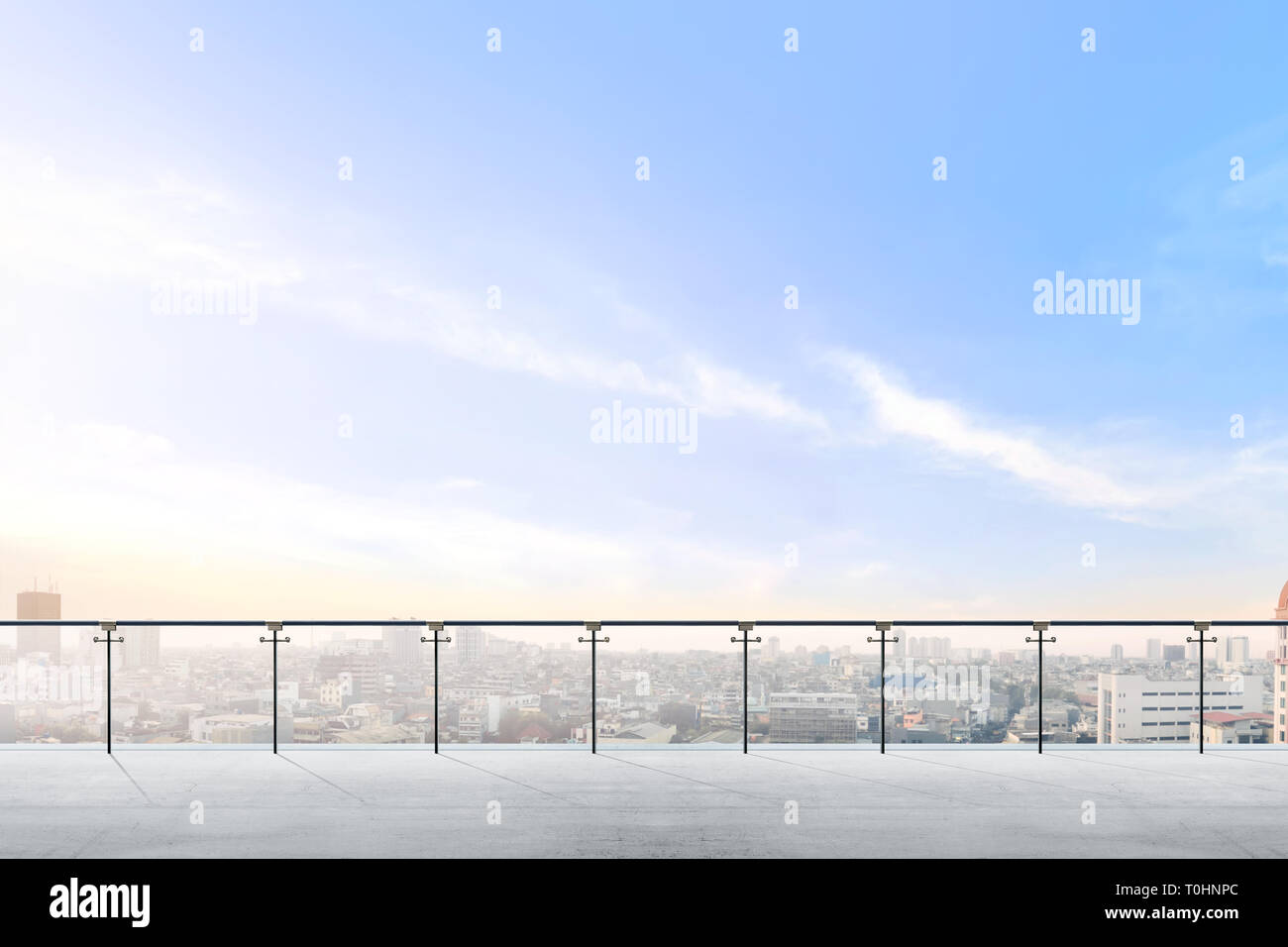 Empty modern terrace area with city view over blue sky background Stock ...