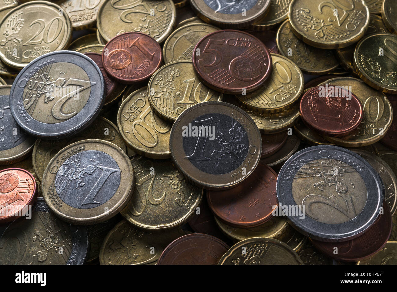 A pile of two and one and 50 cent euro coins, made of copper and nickel ...