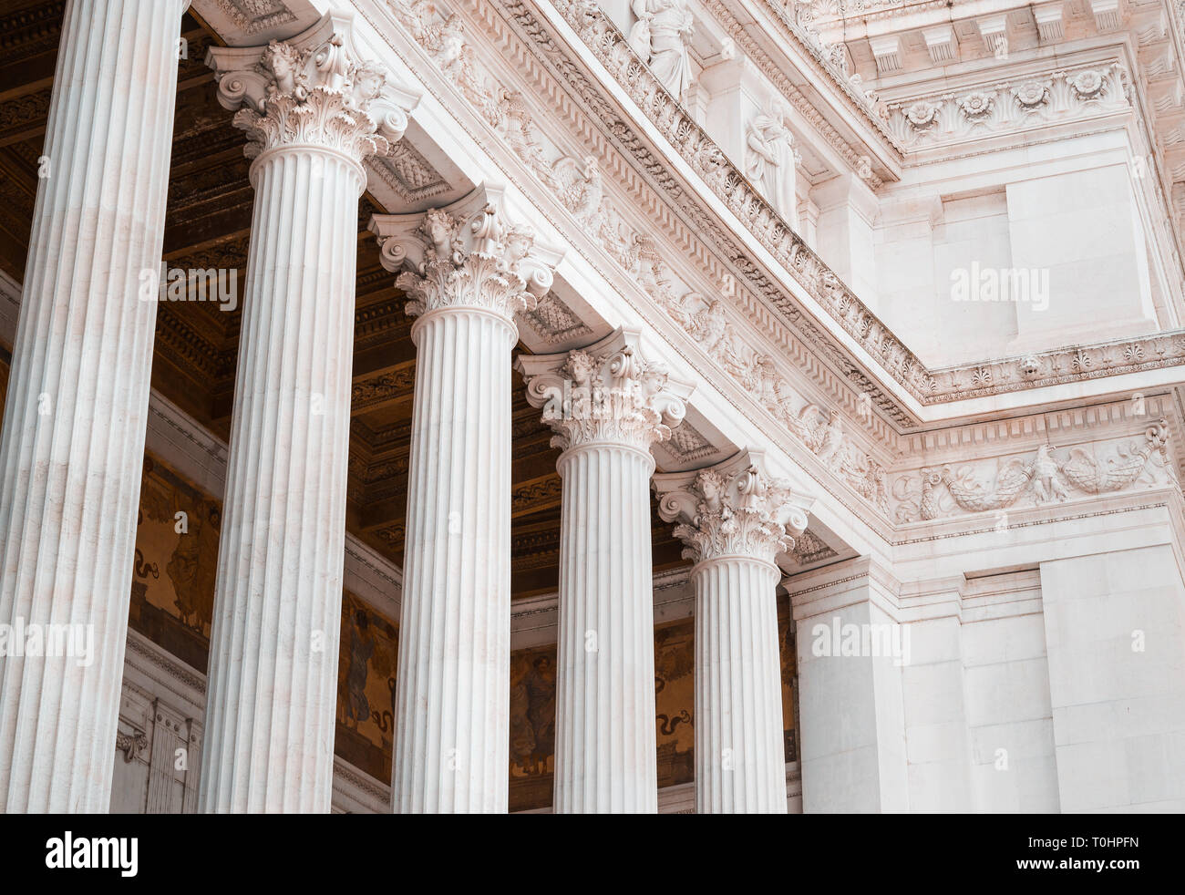 Close-up with detail of the stone and marble colonnade of the monument ...