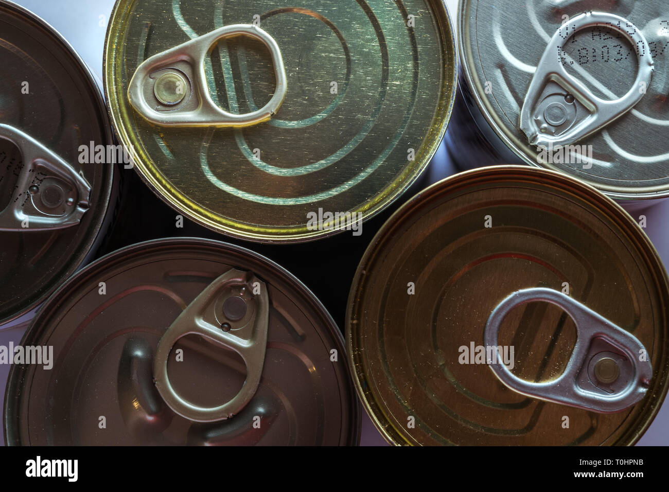 Close-up of a group of tin cans of food packaging in aluminum box with ...
