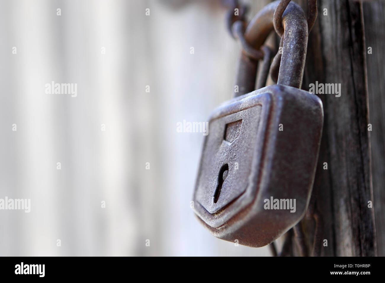 Close-up of lock and chains on old door Stock Photo - Alamy
