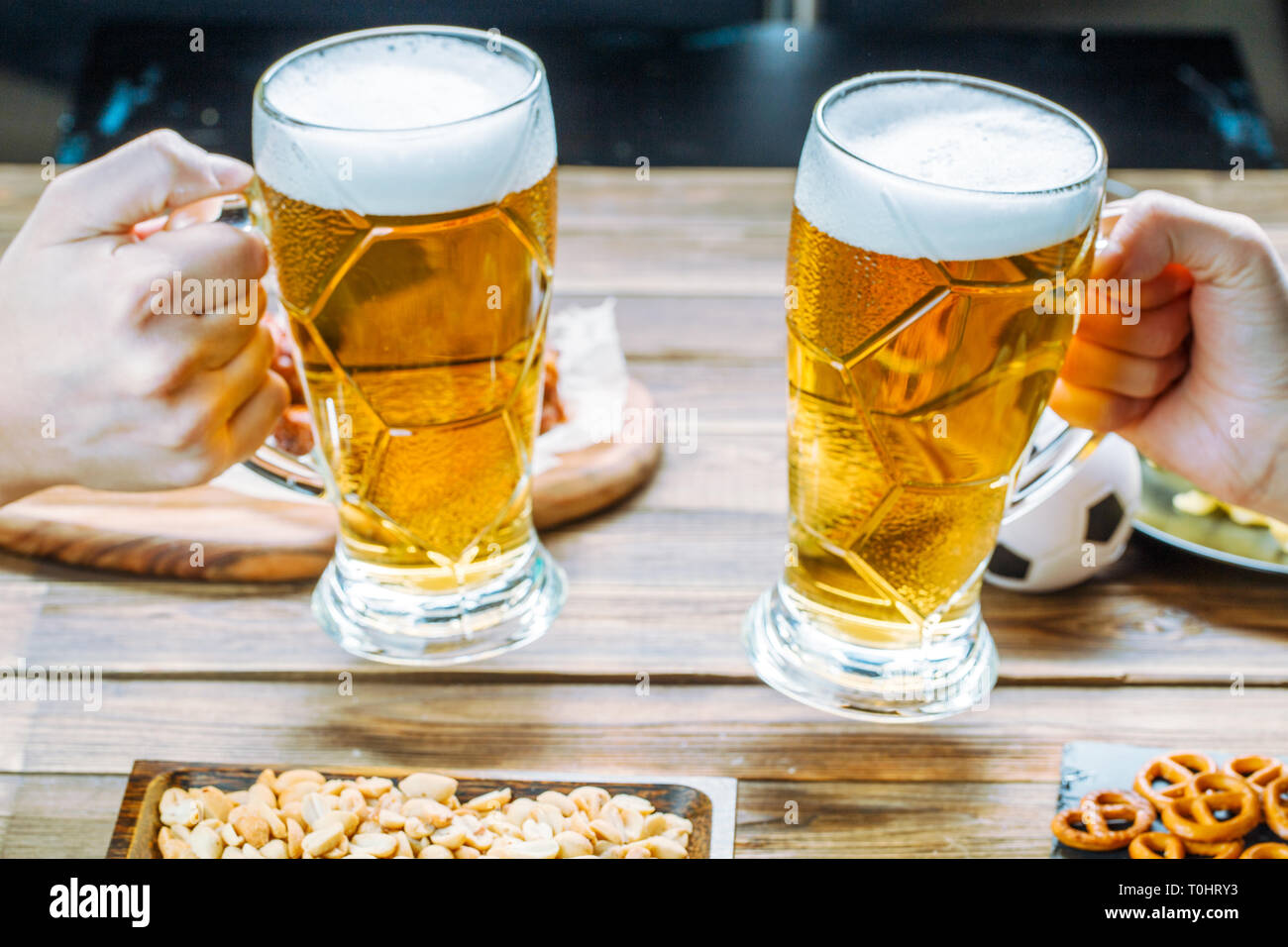 Appetizers and beer on the table for watch the football match Stock ...