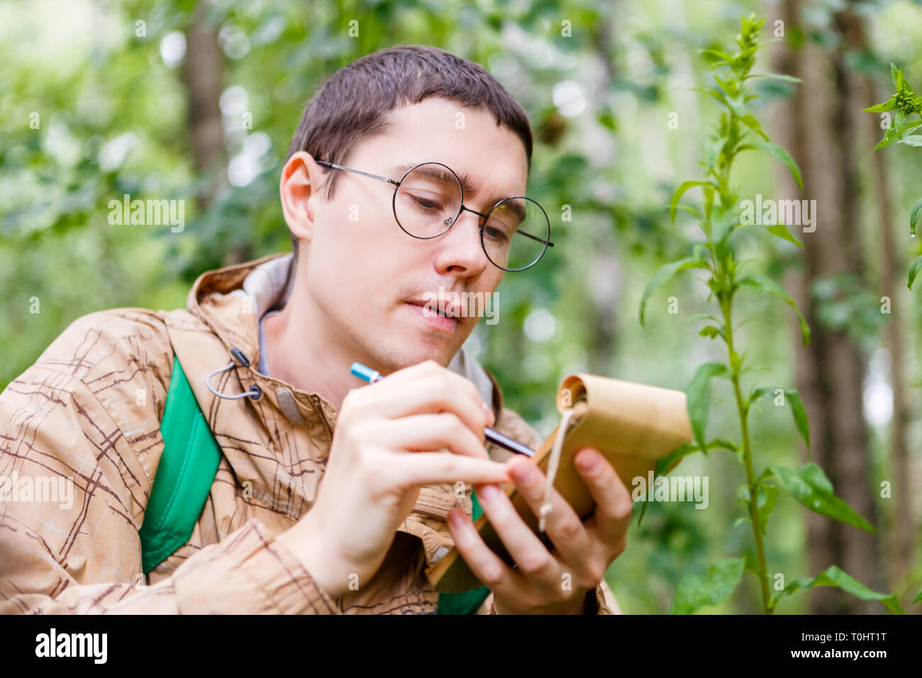 Picture of dark-haired biologist with glasses Stock Photo - Alamy