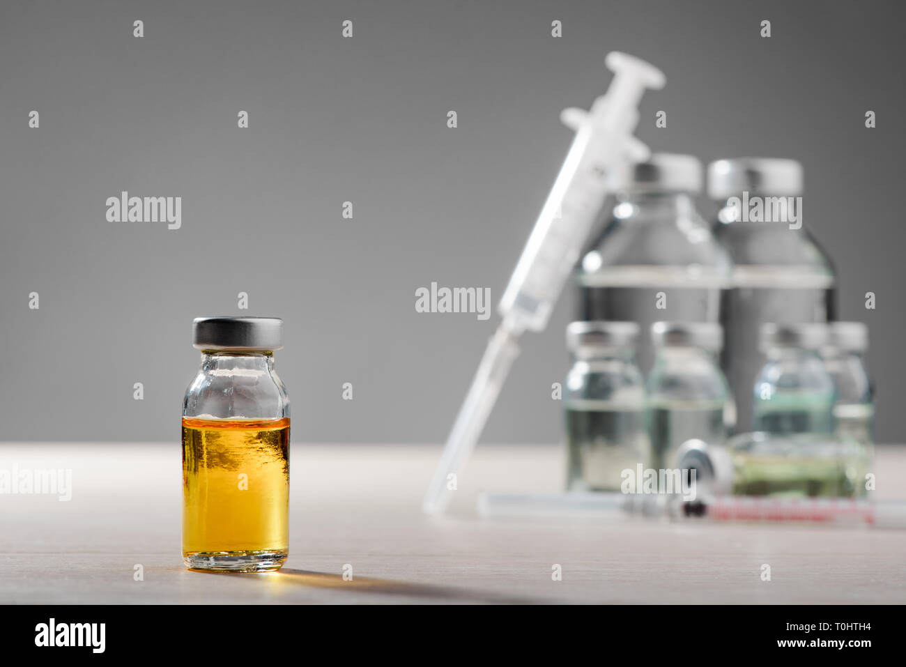 Vial of yellow medicine Stock Photo - Alamy