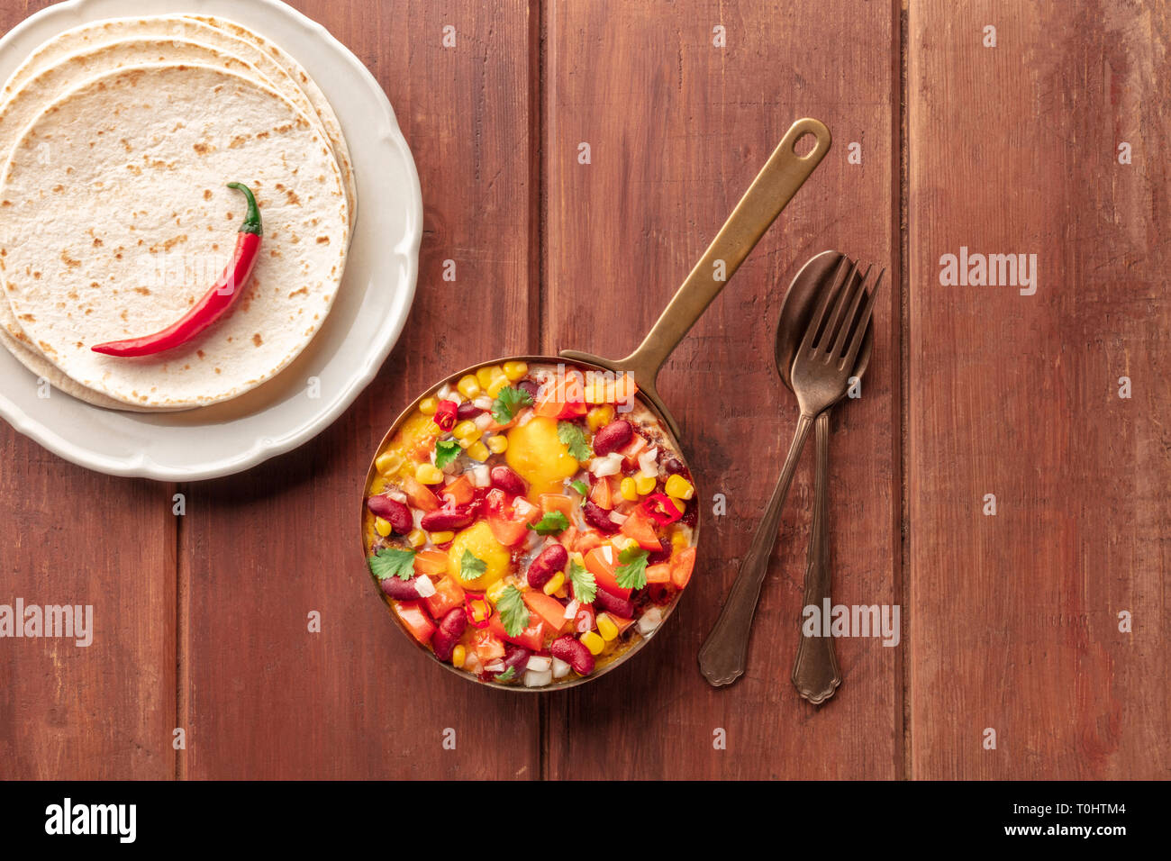 Huevos rancheros, Mexican fried eggs, shot from the top with pico de ...