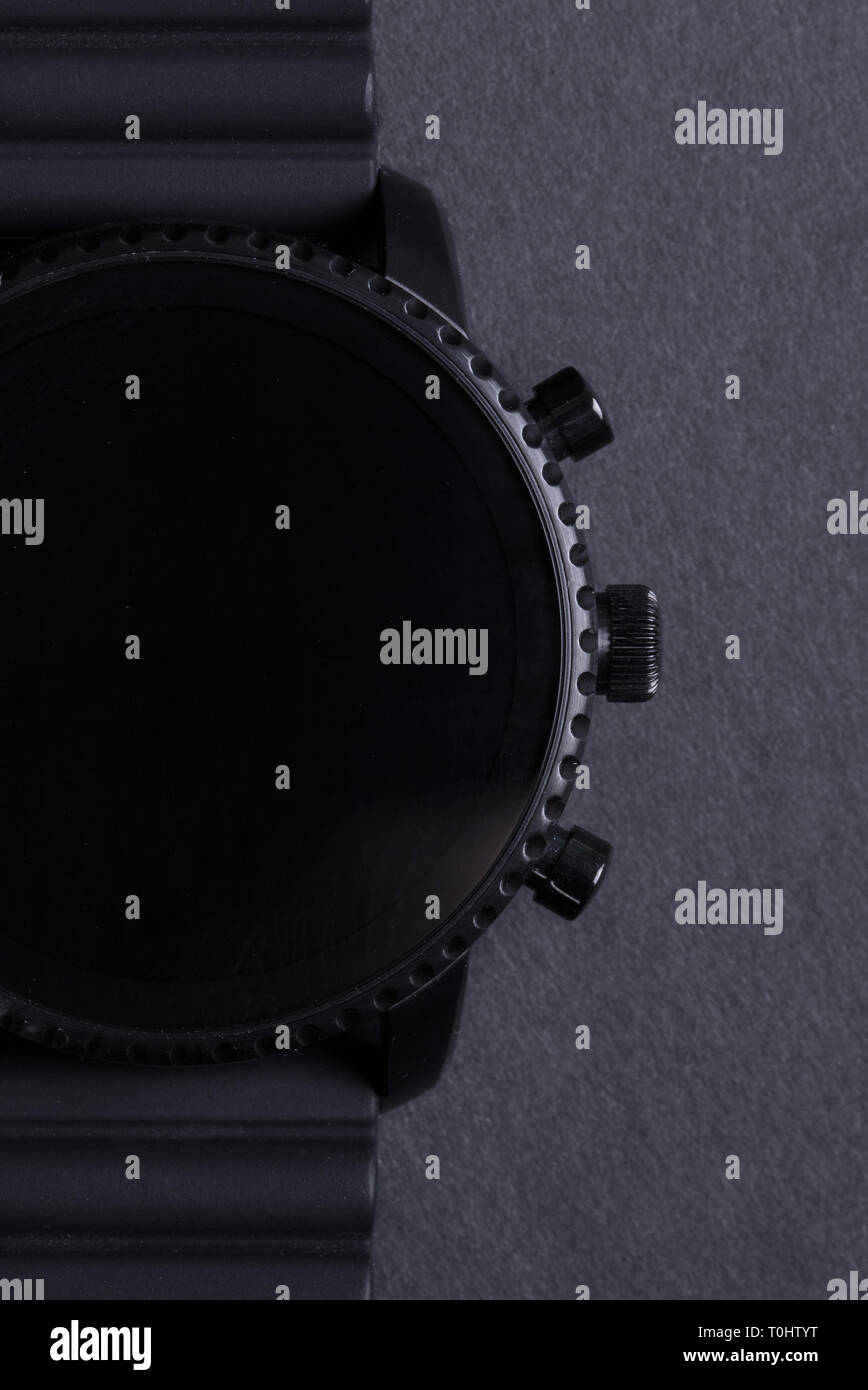 Black smartwatch isolated on a black background Stock Photo - Alamy
