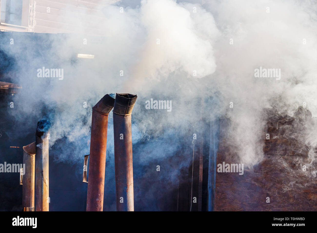 Pipes with smoke from a samovar. Russian traditions Stock Photo - Alamy