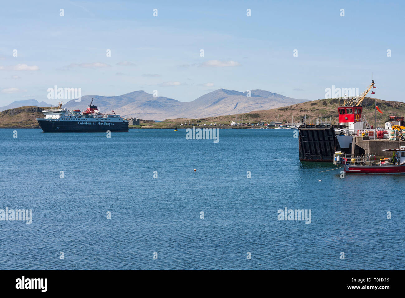 Island Ferry in harbour sailing in to dock at Oban, Argyll & Bute ...
