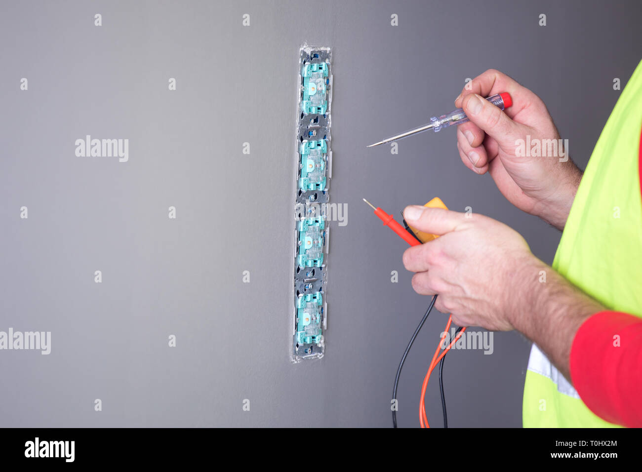 hands of an electrician at work Stock Photo - Alamy