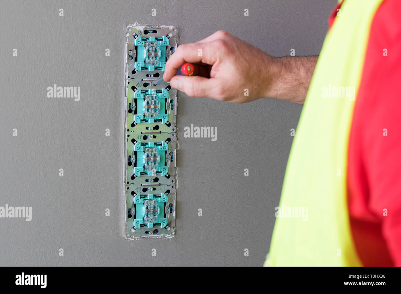 hands of an electrician at work Stock Photo - Alamy