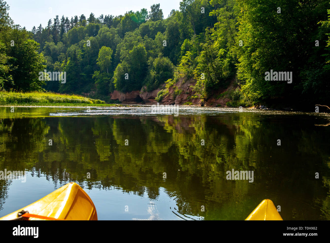 Kayak and canoe ride in river Gauja in Latvia. Boat ride by the river ...