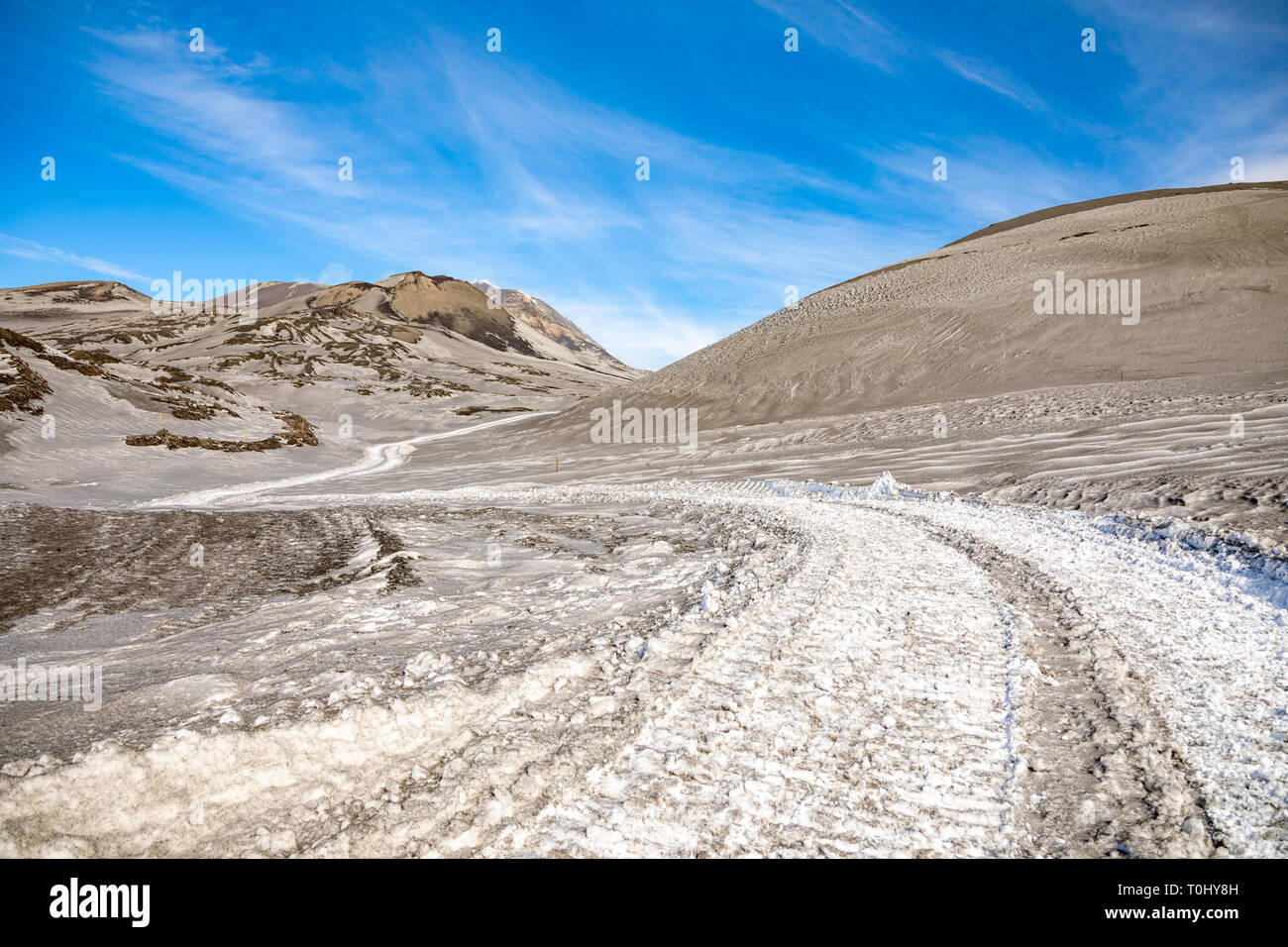 Footpath to Etna Volcano with smoke in winter, volcano landscape in ...