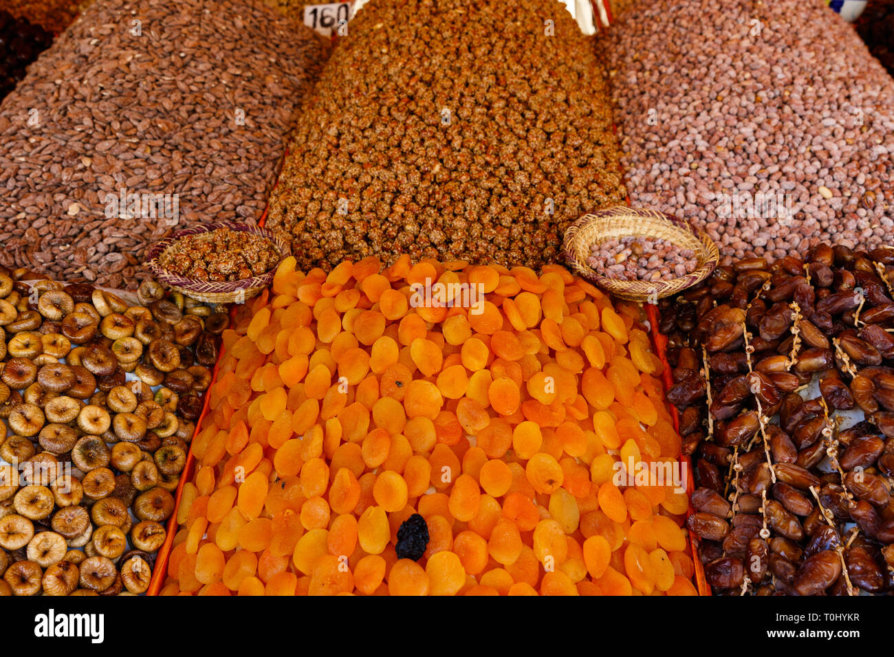 Dried fruit and nuts on market stall at the djemaa el fna square in ...