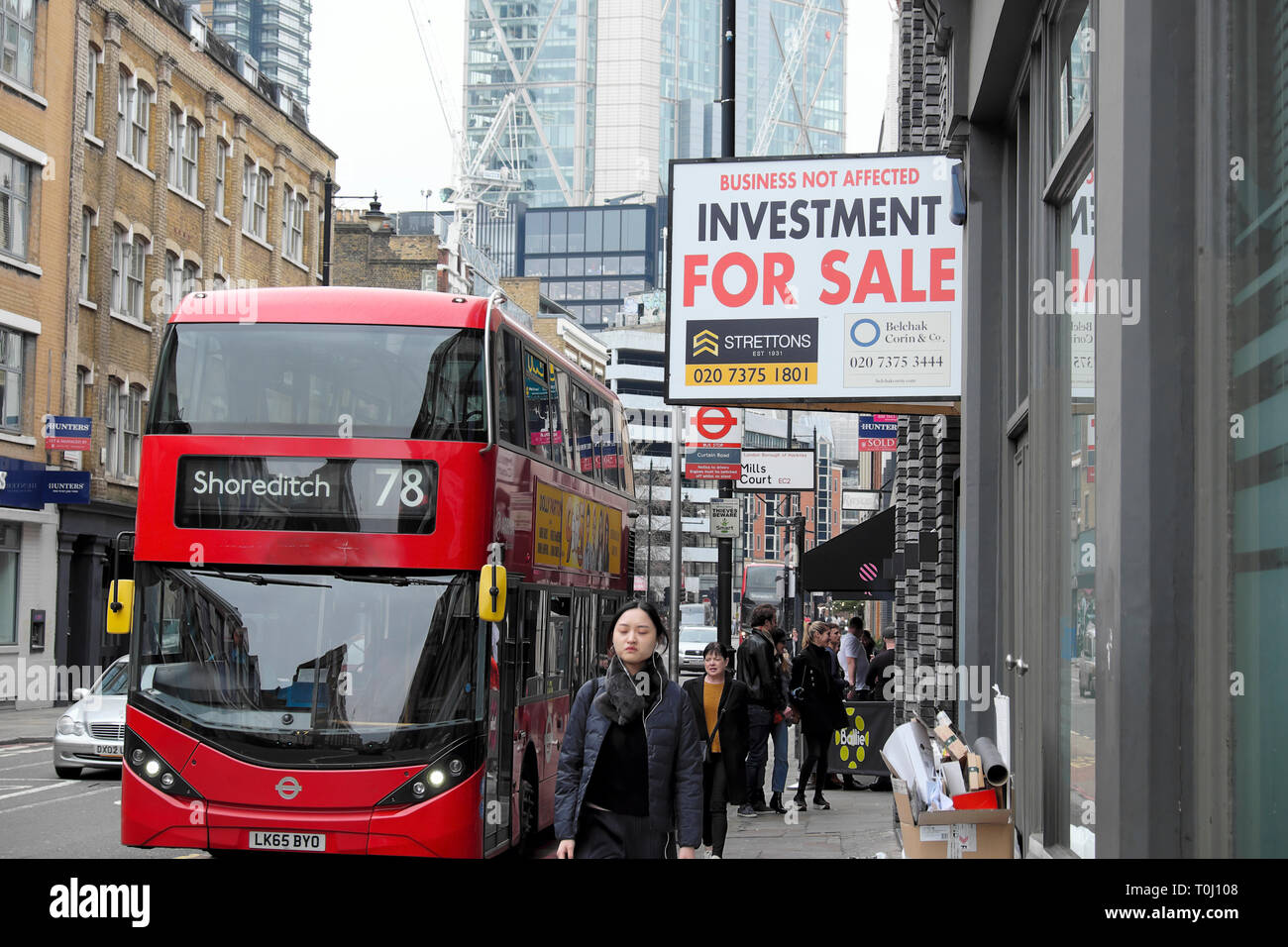 The 78 Shoreditch bus and property for sale investment sign in a street ...
