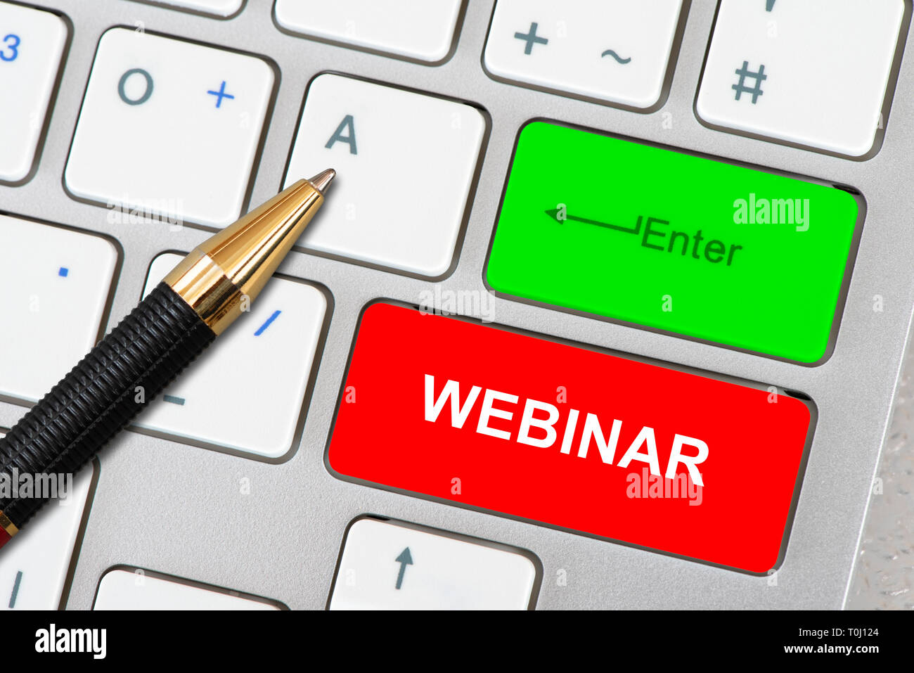 webinar printed on computer keyboard Stock Photo - Alamy
