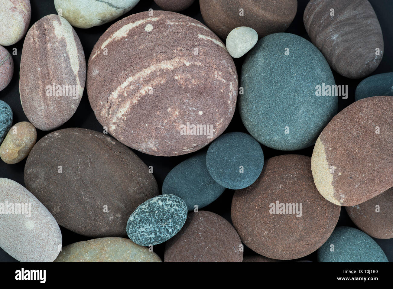 Colorful pebble for background Stock Photo - Alamy