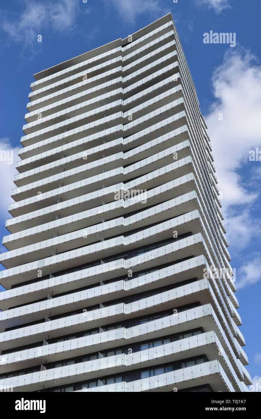 Side View Of New Condo Tower, Symmetrical With Lots of Glass. Light ...