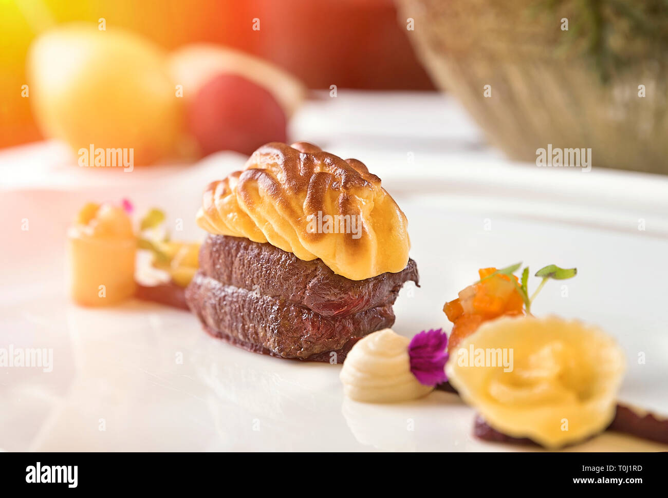 Baked deer fillet with Jus sauce and root vegetables Stock Photo - Alamy