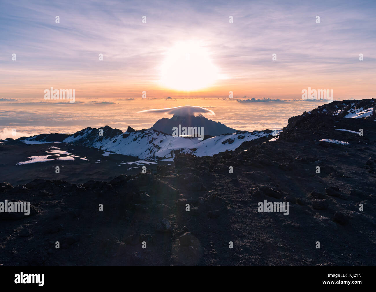 Stunning sunrise view of Mawenzi Peak across the crater at the summit ...
